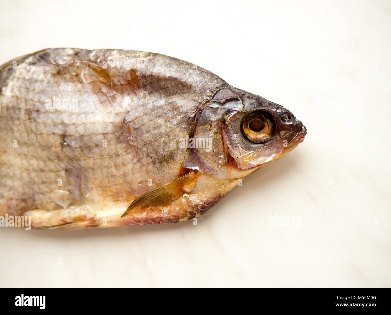 The Dried Fish Bream on a color background Stock Photo - Alamy