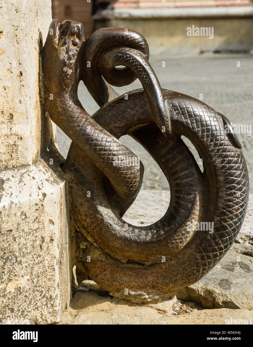 Coiled bronze snake ornament attached to one of the palaces around the ...