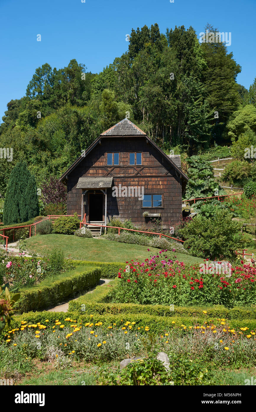 Traditional wooden farm buildings set in the landscaped gardens of the ...