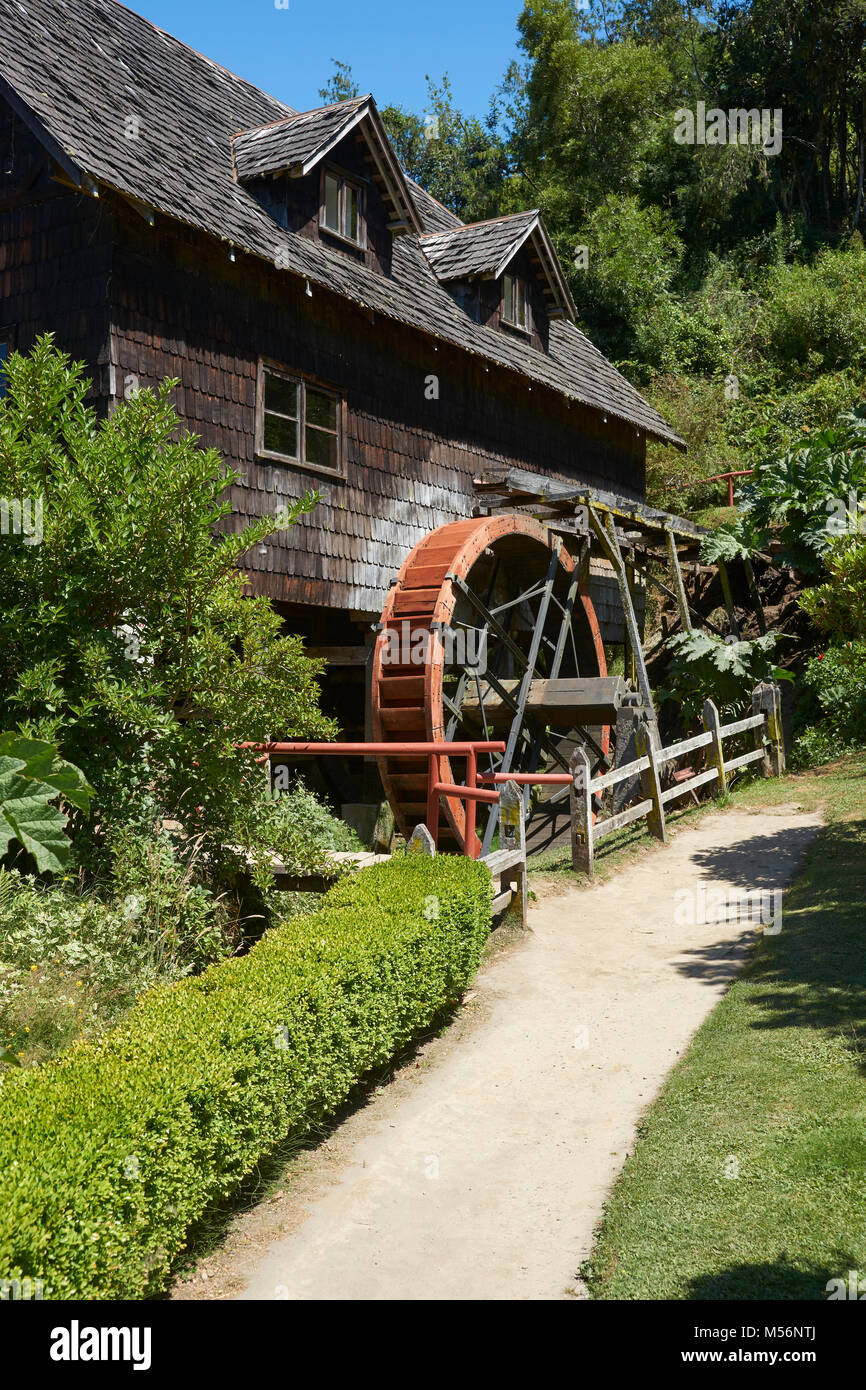 Traditional wooden farm buildings set in the landscaped gardens of the ...