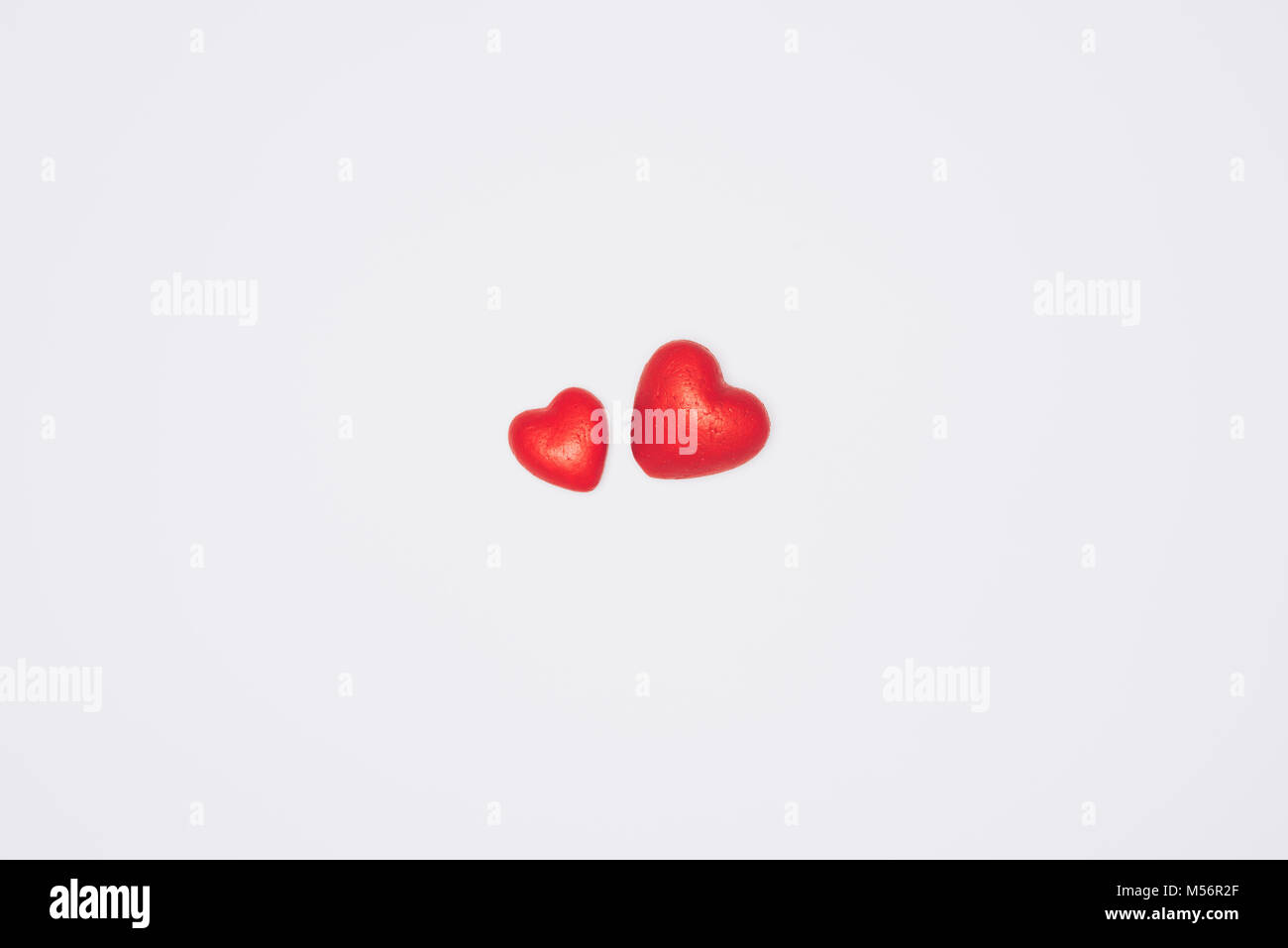 small red hearts isolated on white Stock Photo - Alamy