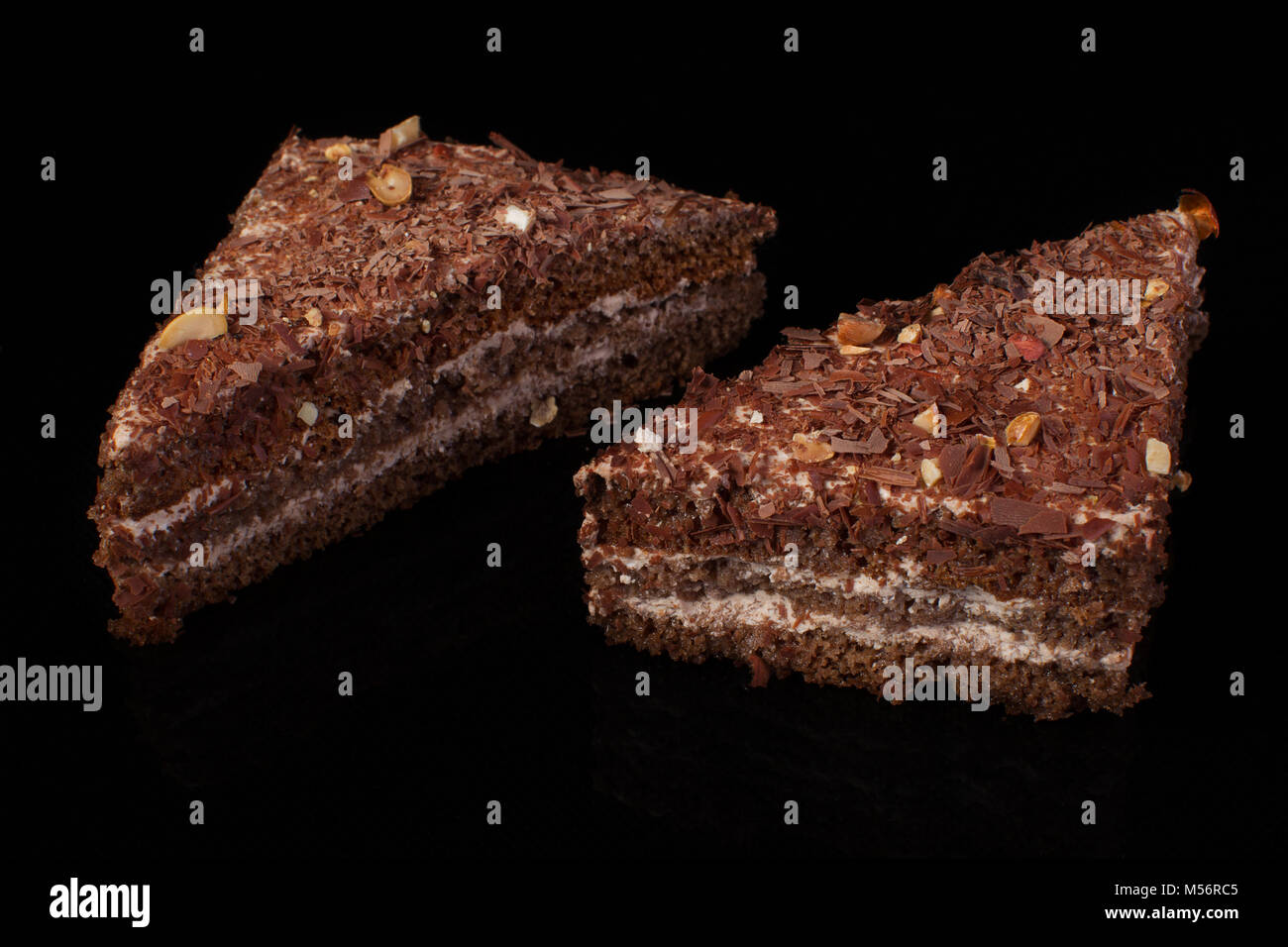 Triangular cake with chocolate sprinkle on a dark background Stock ...