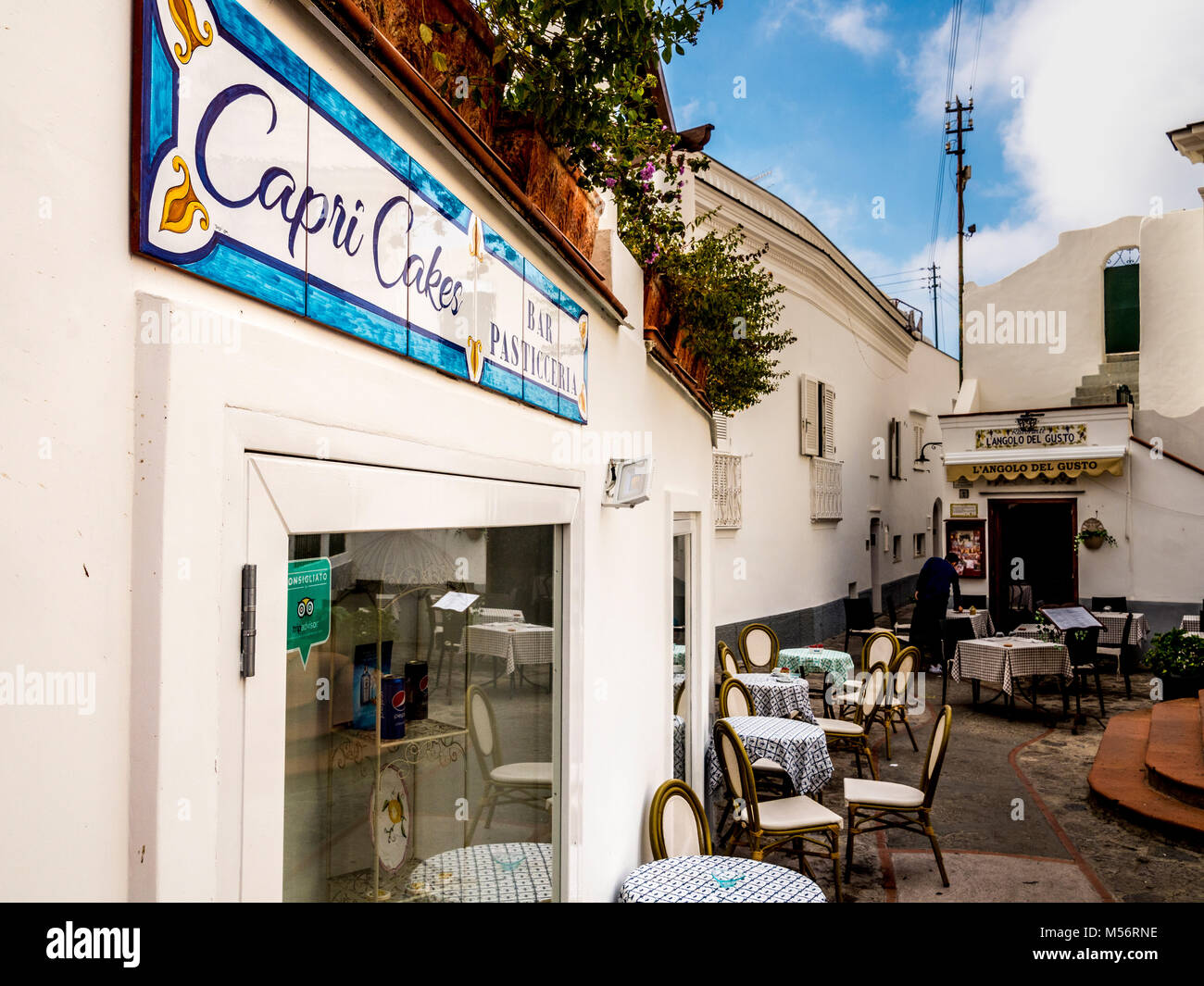 Tiled Capri Cakes sign on cafe Stock Photo - Alamy