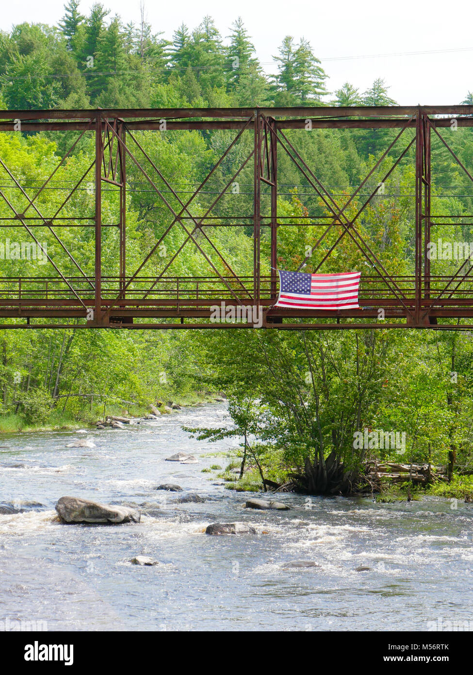 American Flag flies over an old train bridge Stock Photo - Alamy