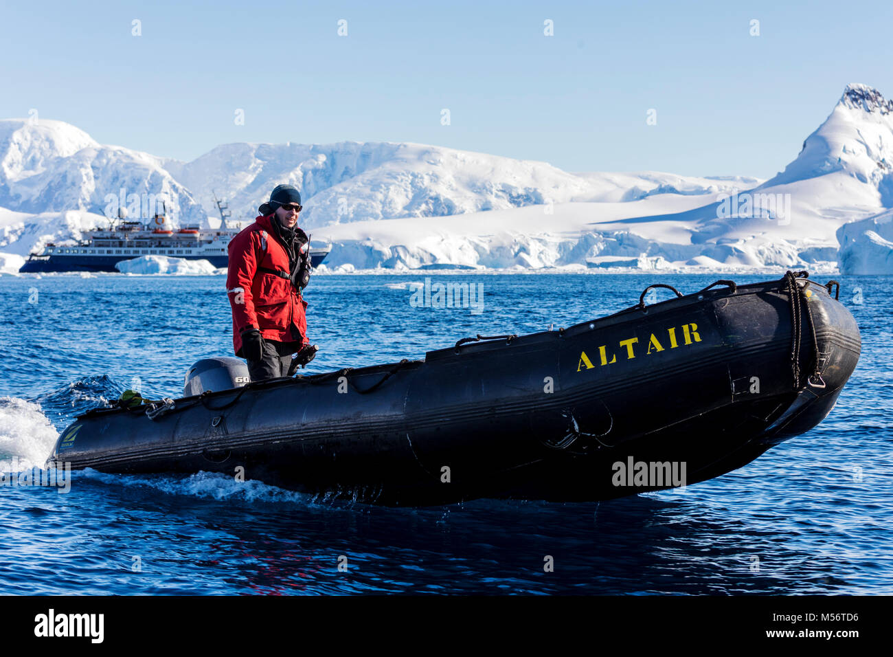 Large inflatable Zodiac boats shuttle alpine mountaineering skiers to ...