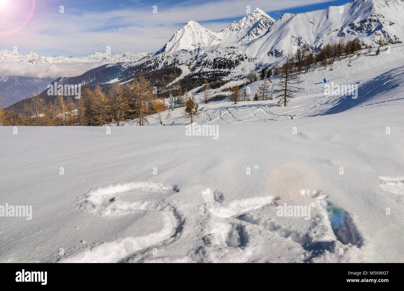 Ski written on fresh powder snow with European Alps background Stock ...