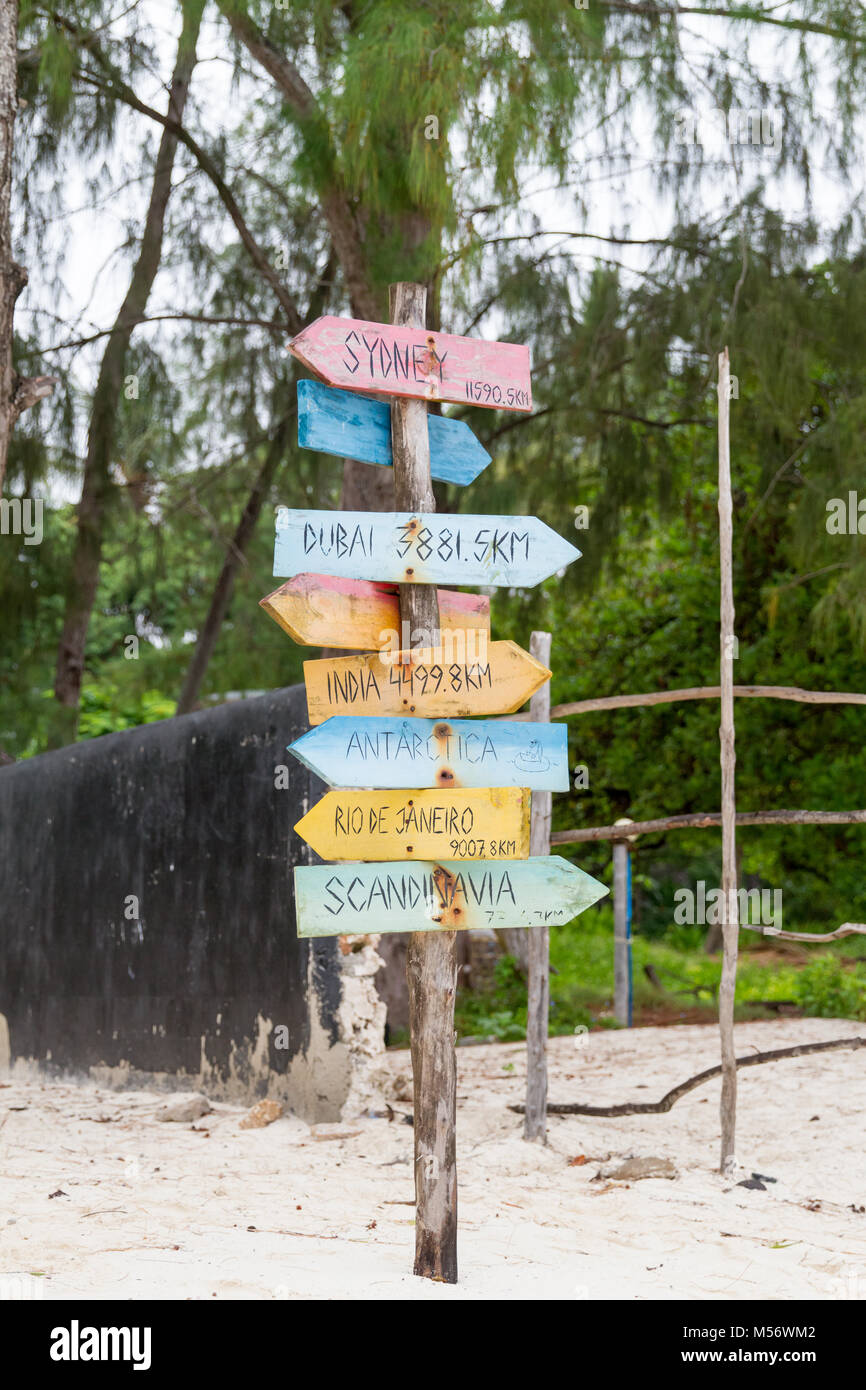 ZANZIBAR, TANZANIA - JANUARY 05: Wooden sign with distance in ...