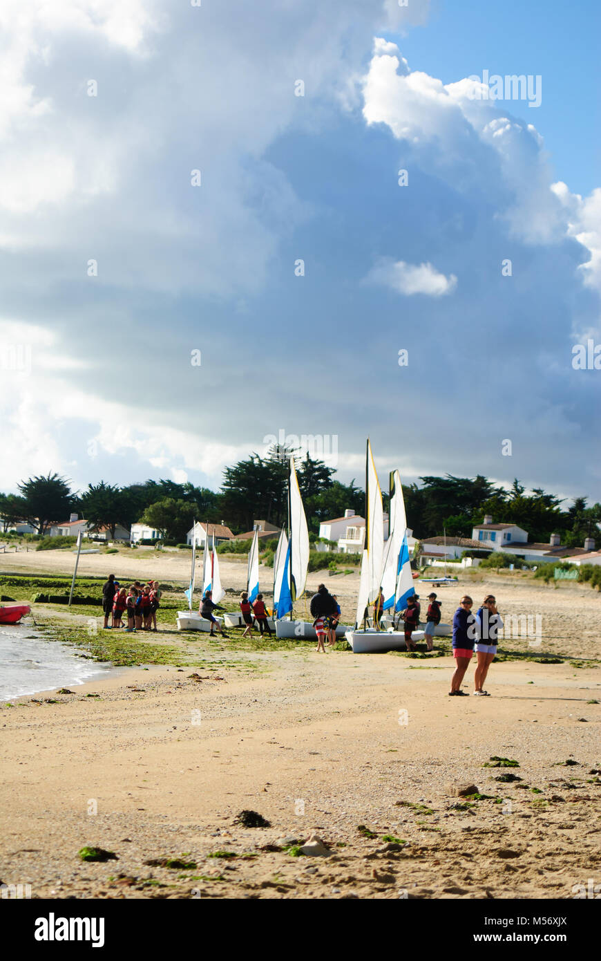 preparing sailing boats on the beach to start a lesson on the sea Stock ...
