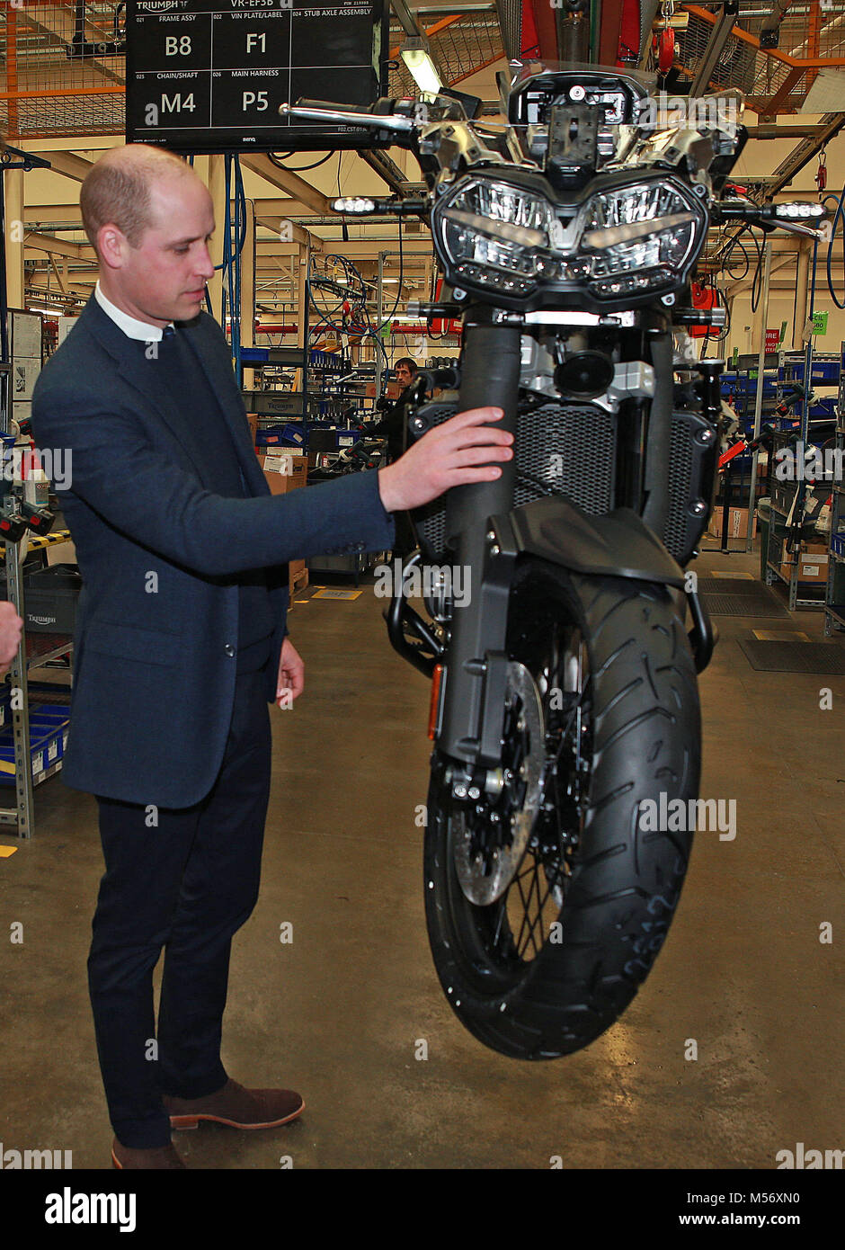 The Duke of Cambridge looks at a motorcycle during a tour of the ...