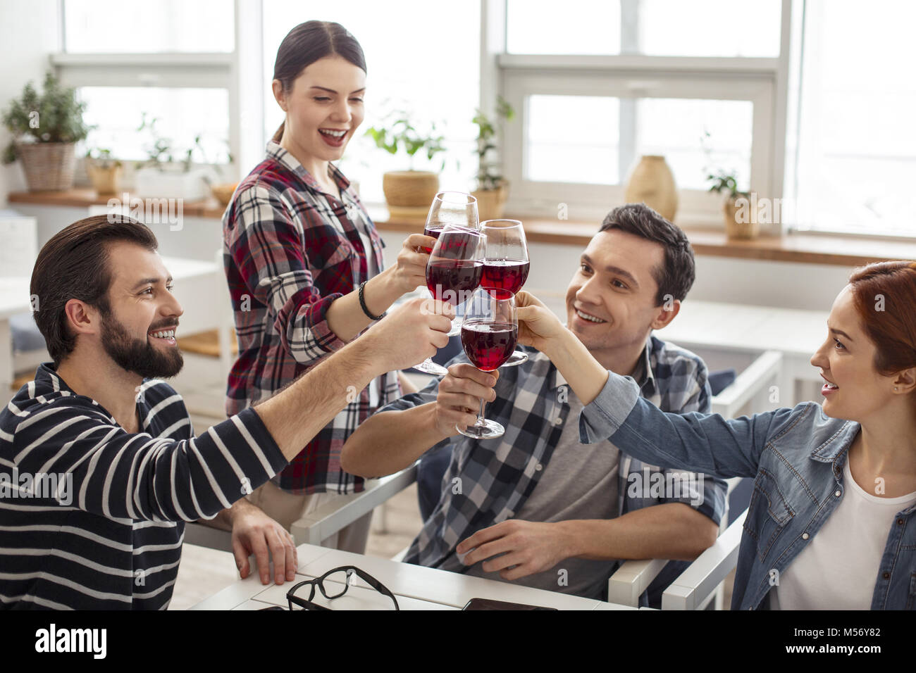 Content friends relaxing together at weekend Stock Photo - Alamy