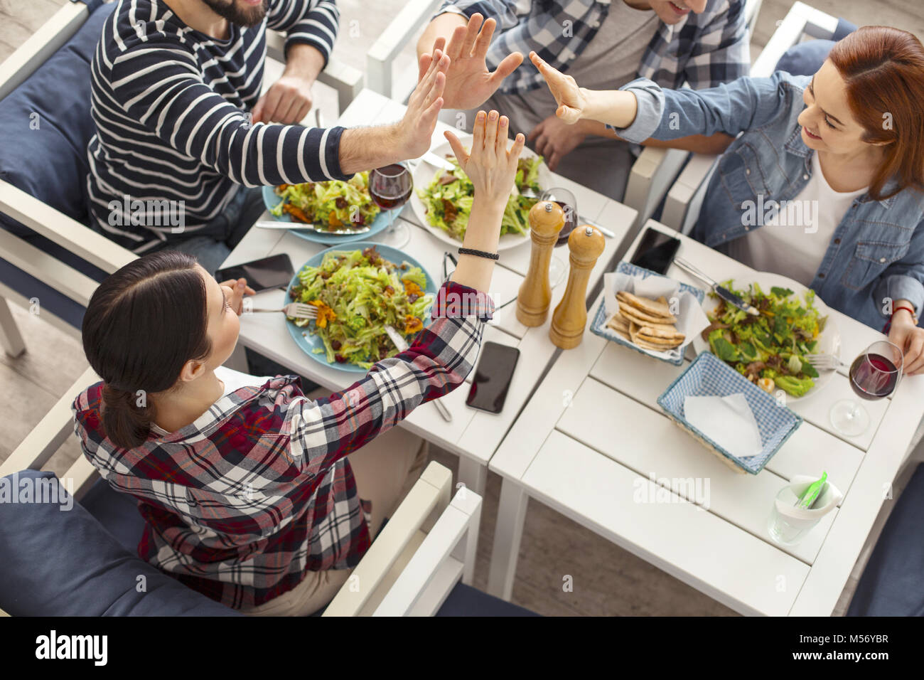 Alert best friends giving a high five Stock Photo - Alamy