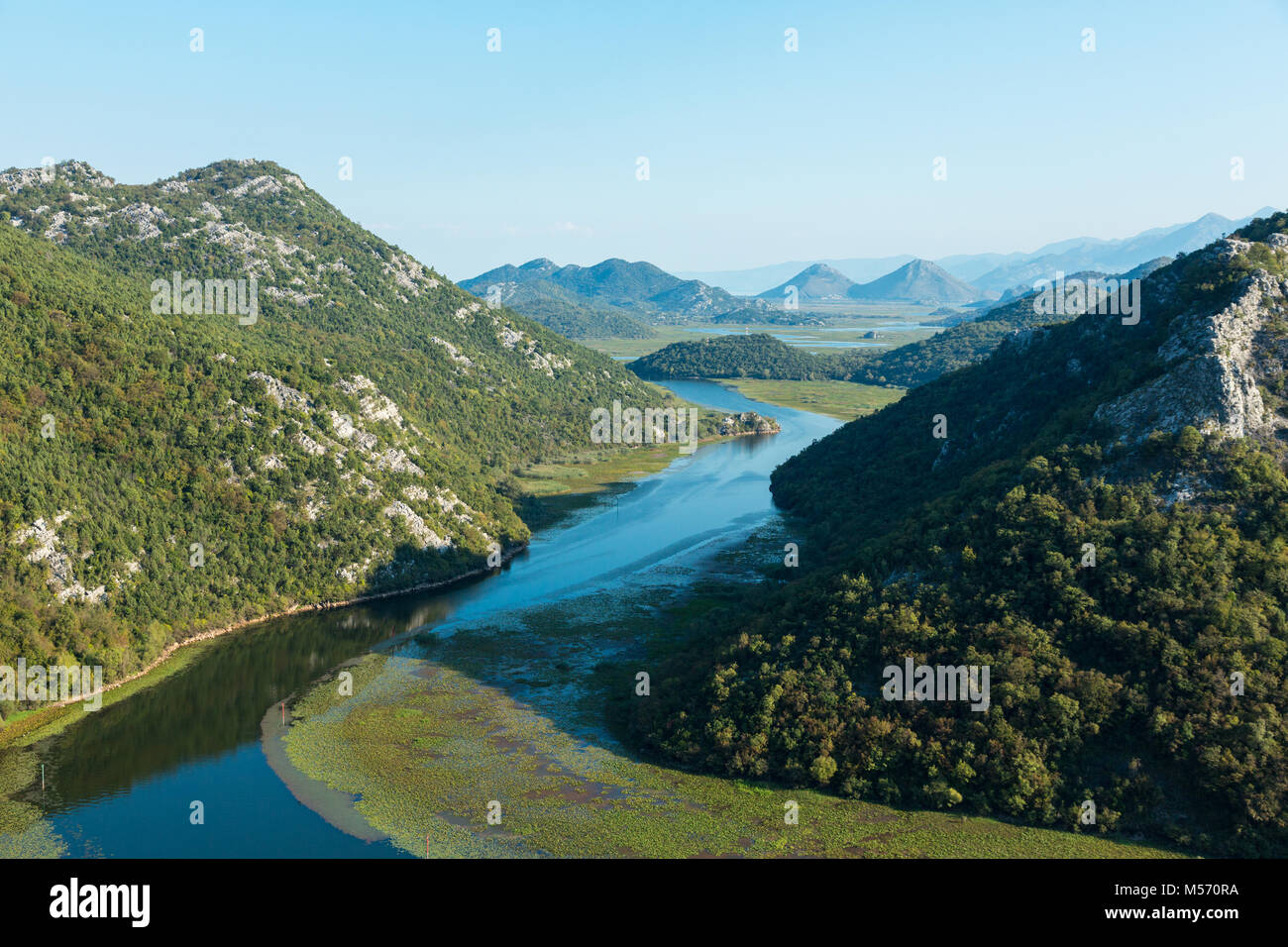 River bend view of the Rijeka Crnojevica river in Skadar Lake National Park, Montenegro, Europe ...