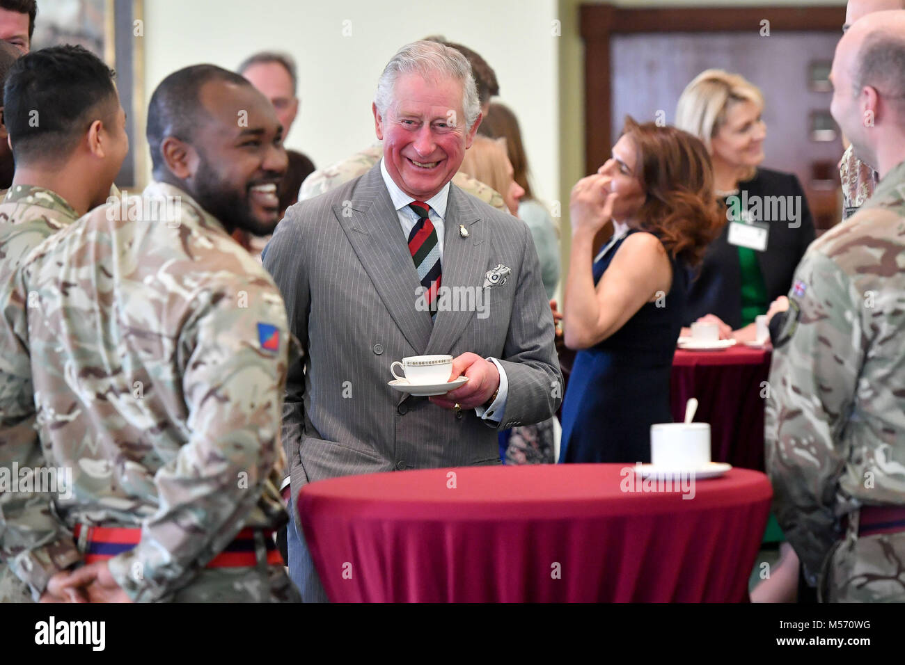 The Prince of Wales has a cup of tea as he meets with soldiers during a ...