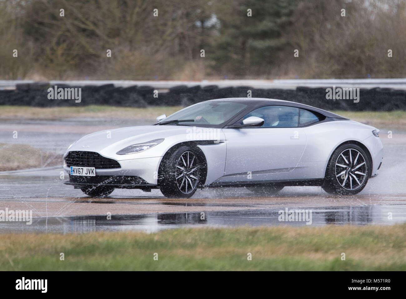 The Duke of Cambridge is driven round the wet handling circuit during a ...