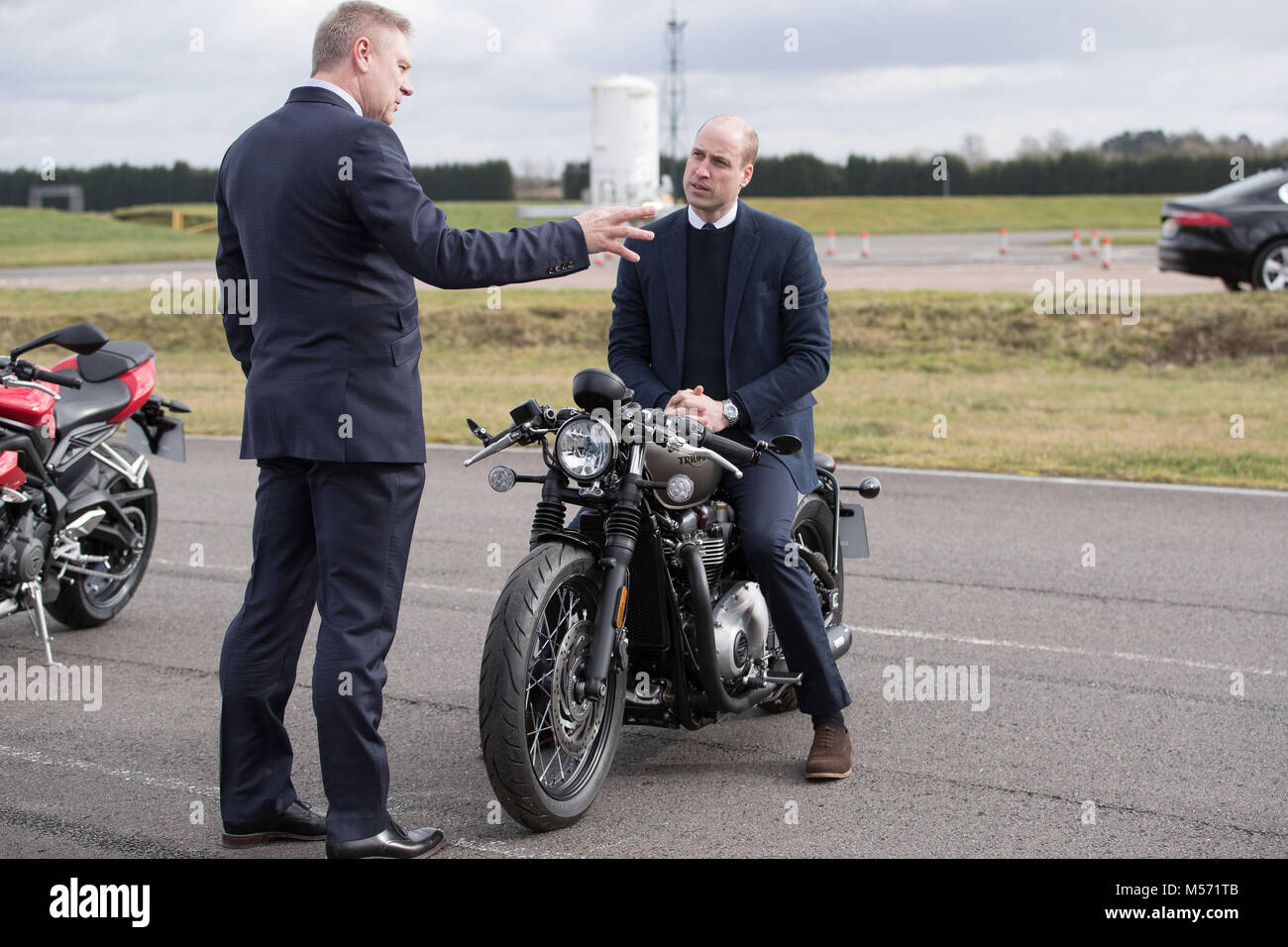The Duke of Cambridge sits upon a Triumph Bobber motorcycle during a ...