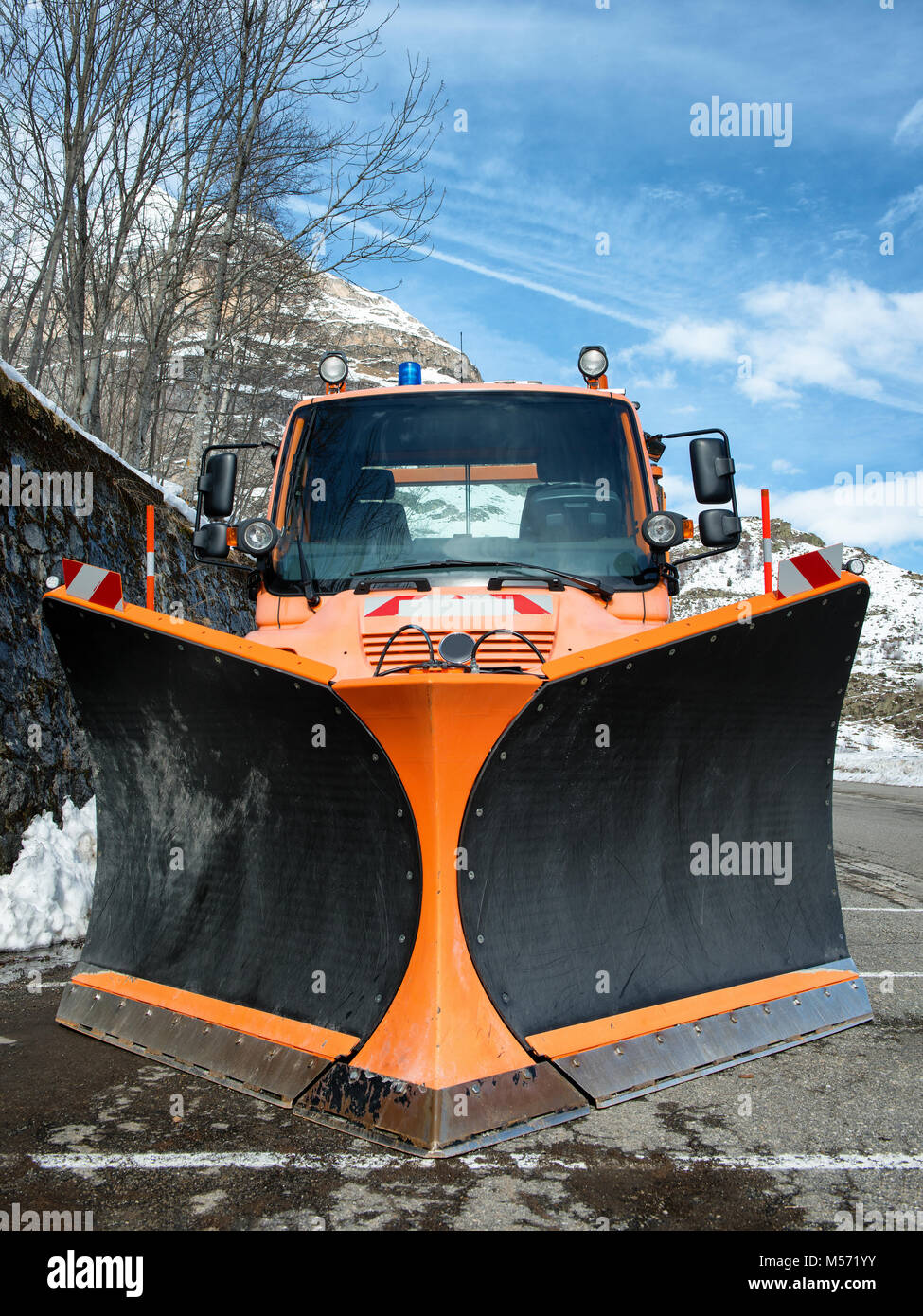 small orange truck using snow plow Stock Photo - Alamy