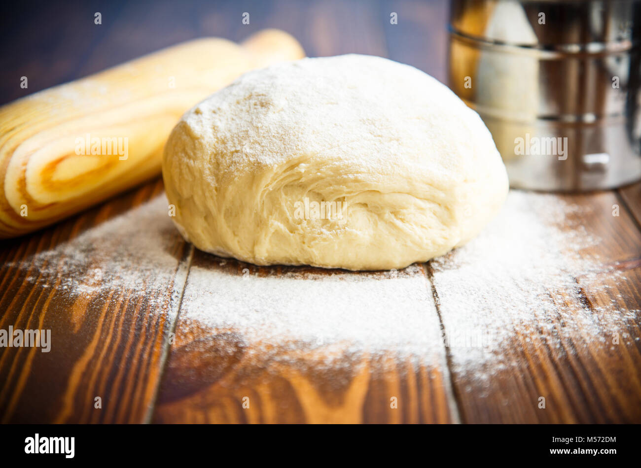 fresh raw dough with a rolling pin Stock Photo - Alamy