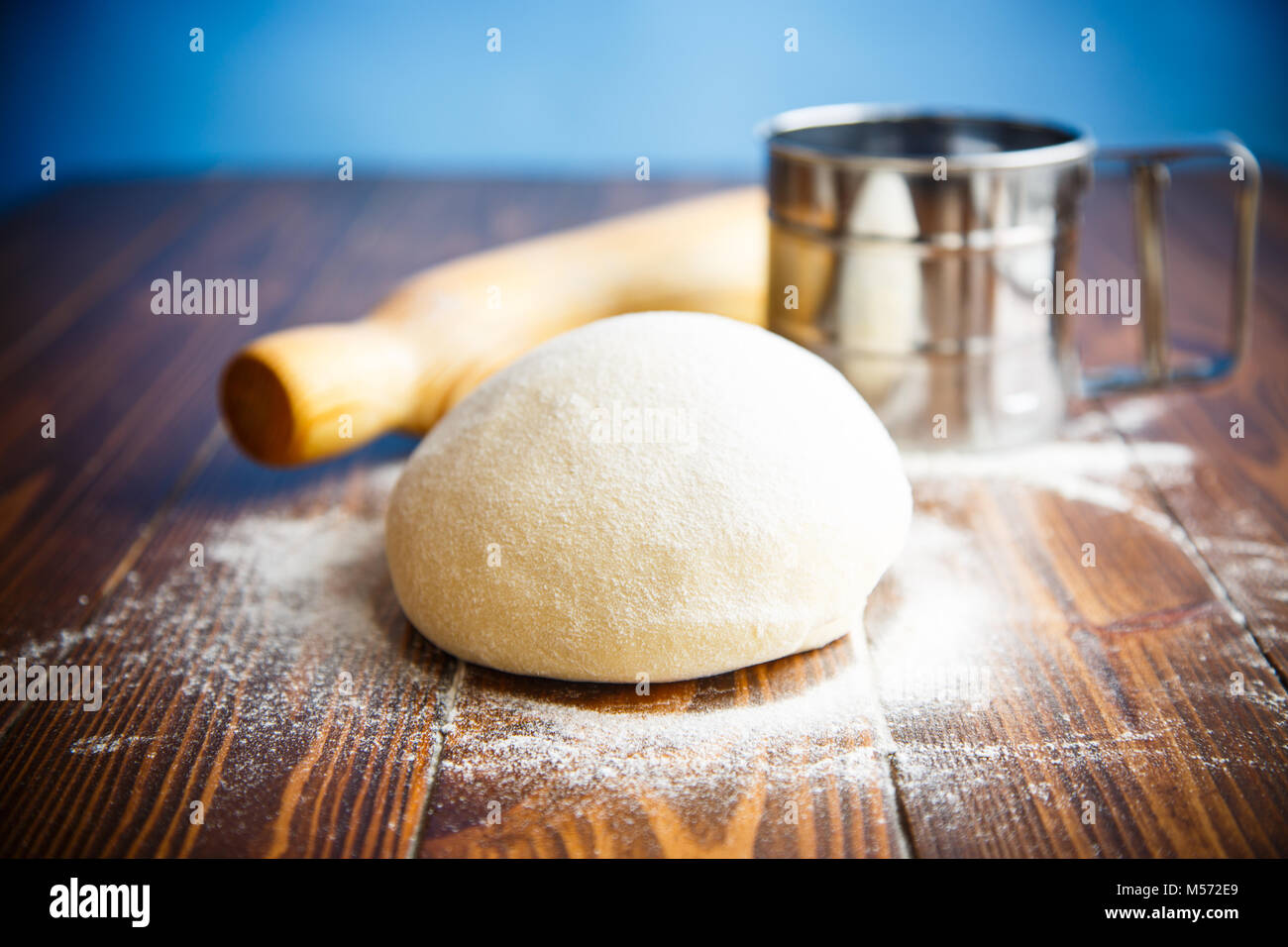 fresh raw dough with a rolling pin Stock Photo - Alamy