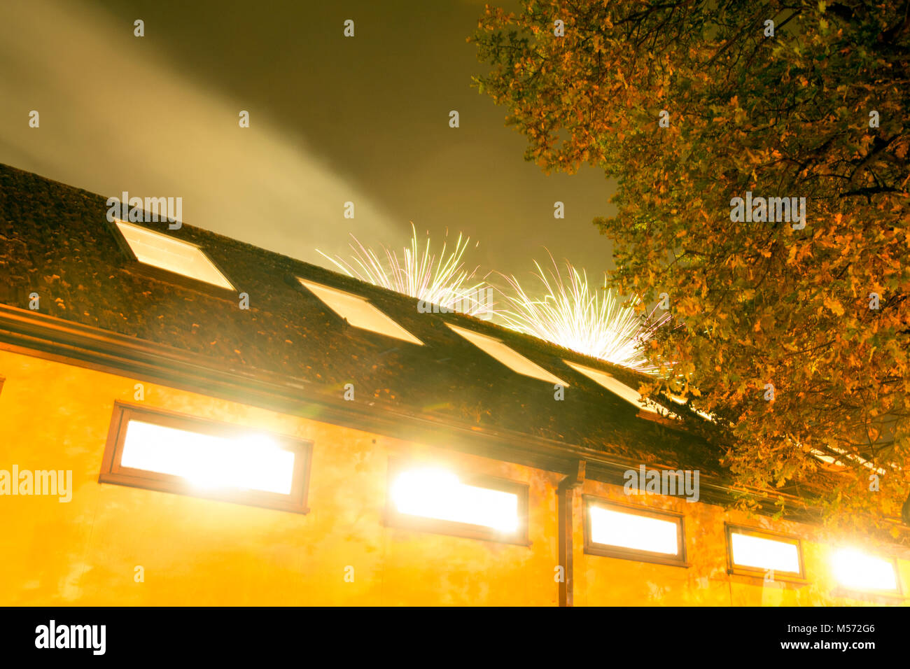 Building illuminated by fireworks Stock Photo - Alamy