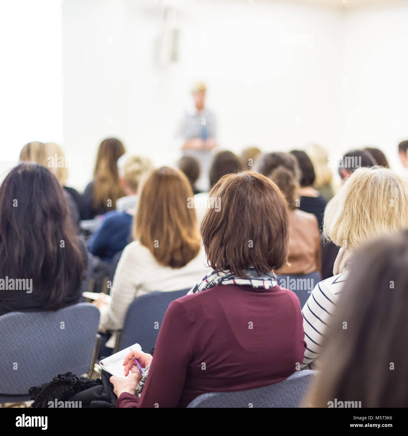 Woman giving presentation on business conference Stock Photo - Alamy