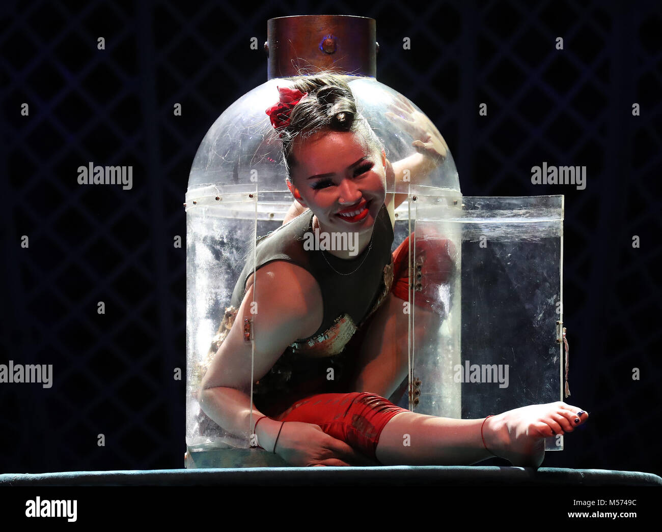 Contortionist Odka sits inside a bottle as she performs with the Cirque ...
