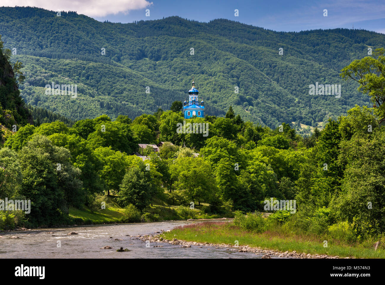 Greek Catholic Church over Tysa river near Rakhiv, Carpathian Mountains ...