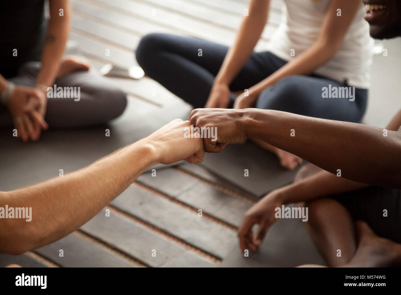 African team fist bump hi-res stock photography and images - Alamy