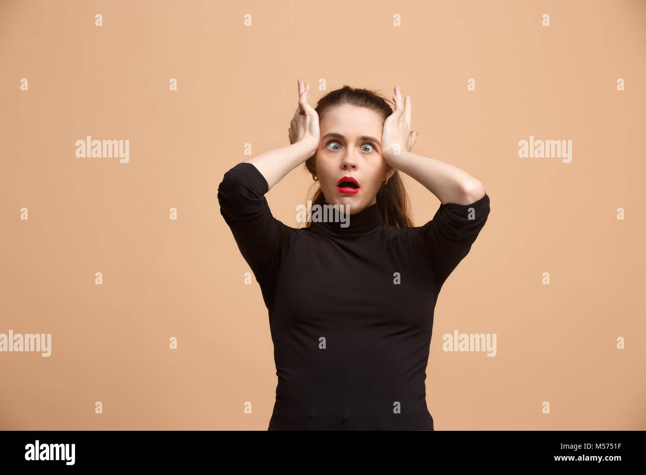 Beautiful woman in stress isolated on pastel Stock Photo - Alamy