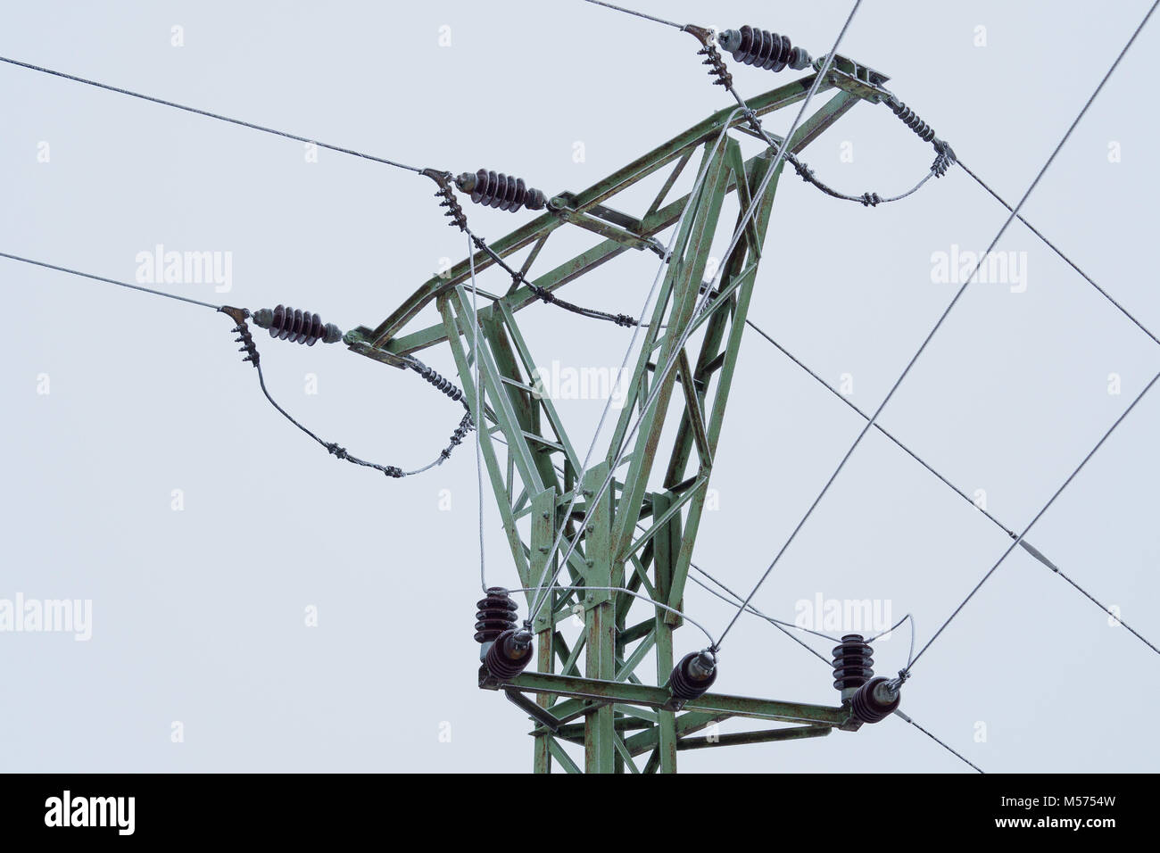 Electrical pylons high voltage, wires in winter covered with frost ...