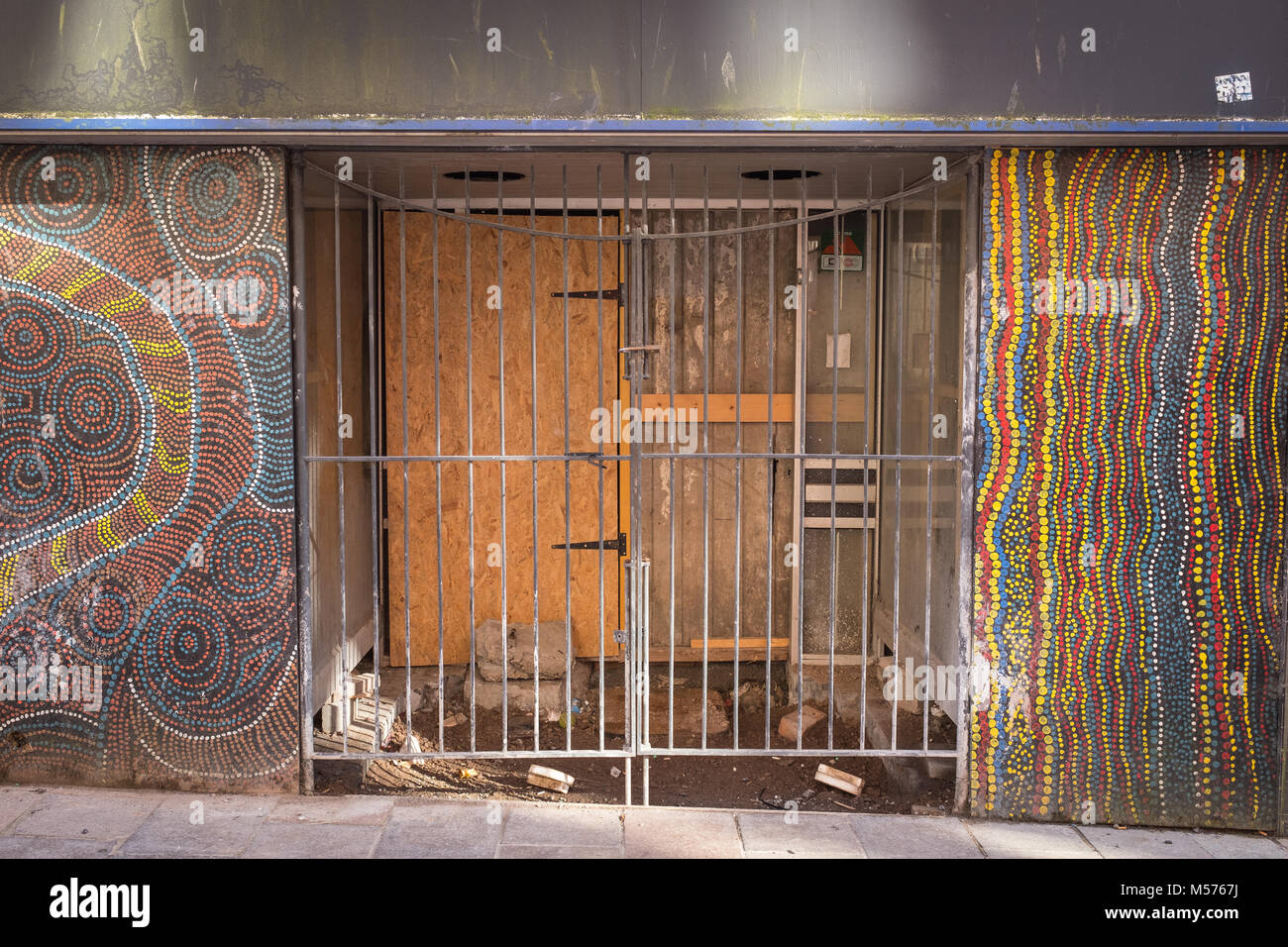 Rundown shop front with painted murals in Friars Vennel, Dumfries Stock ...