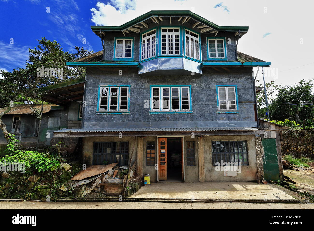 Filipino vernacular architecture-three storey grey cottage with tin ...