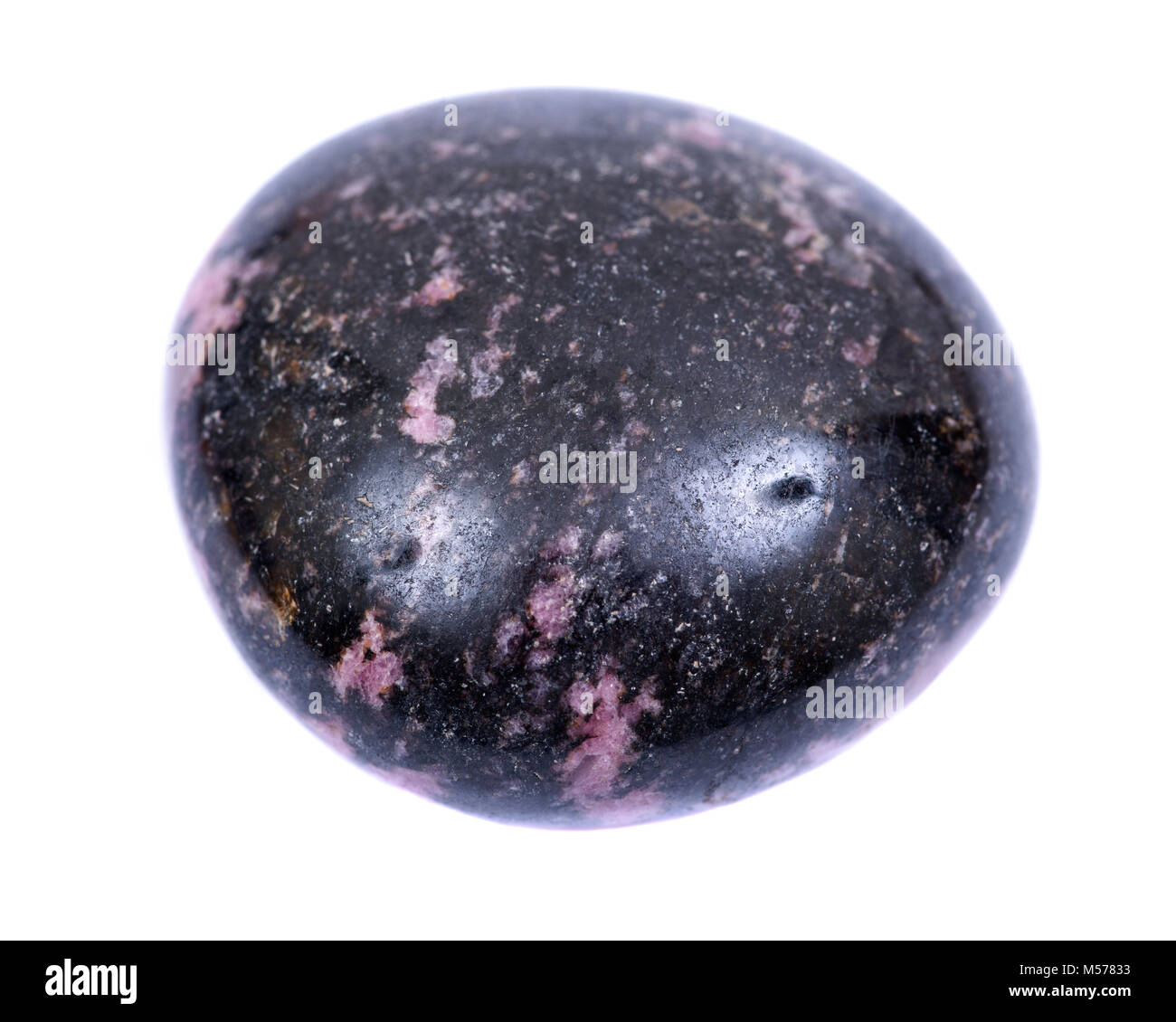 Rhodonite polished palm stone from Madagascar isolated on white ...