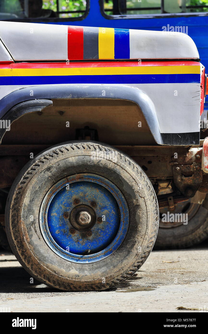 Filipino white-color striped dyipni-jeepney. Public transport in Sagada ...