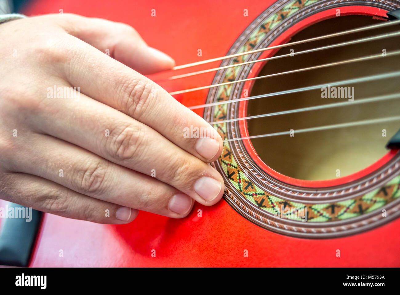 Hand movement while playing a guitar Stock Photo - Alamy