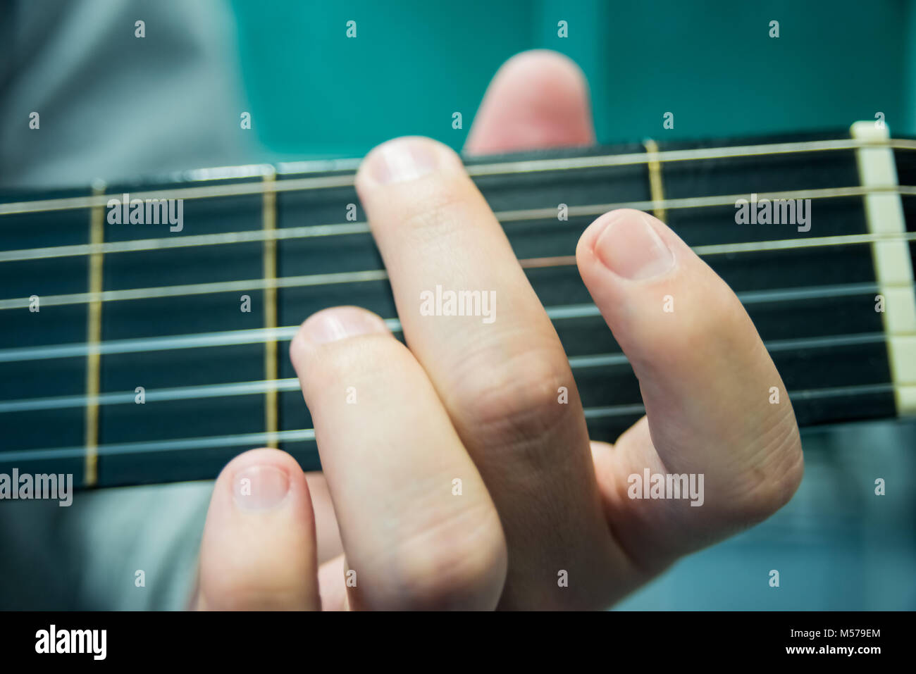 Hand movement while playing a guitar Stock Photo - Alamy