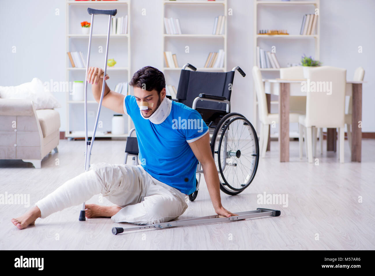 Injured young man recovering at home Stock Photo - Alamy