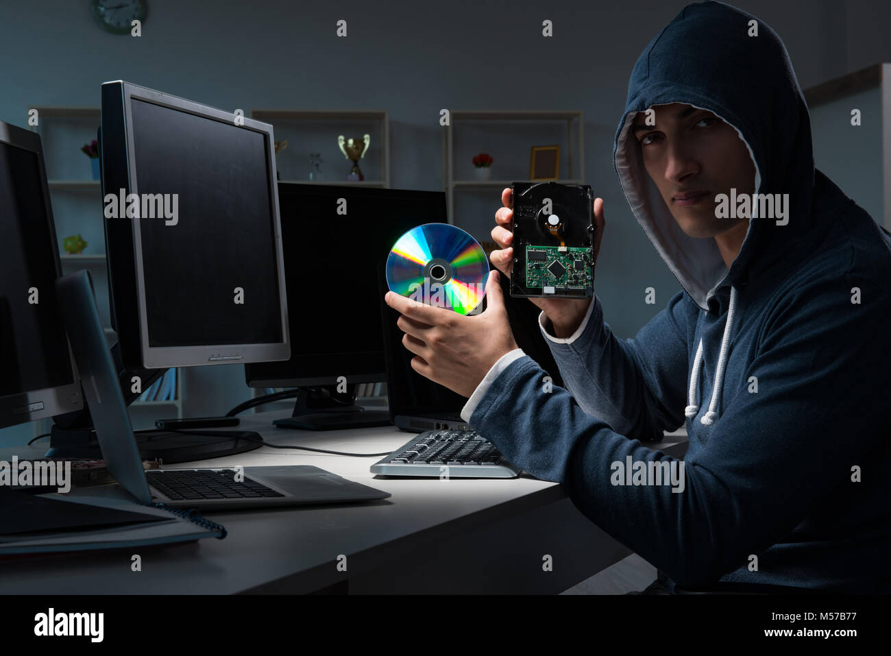 Hacker hacking computer at night Stock Photo - Alamy