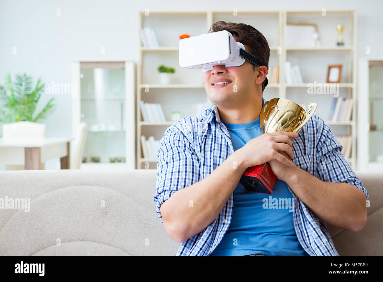 Man wearing virtual reality VR glasses receiving prize cup award Stock ...