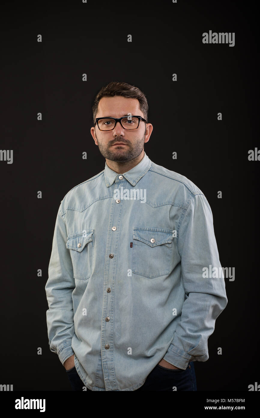 Handsome man in texas shirt and glasses ,Studio shot, black background ...
