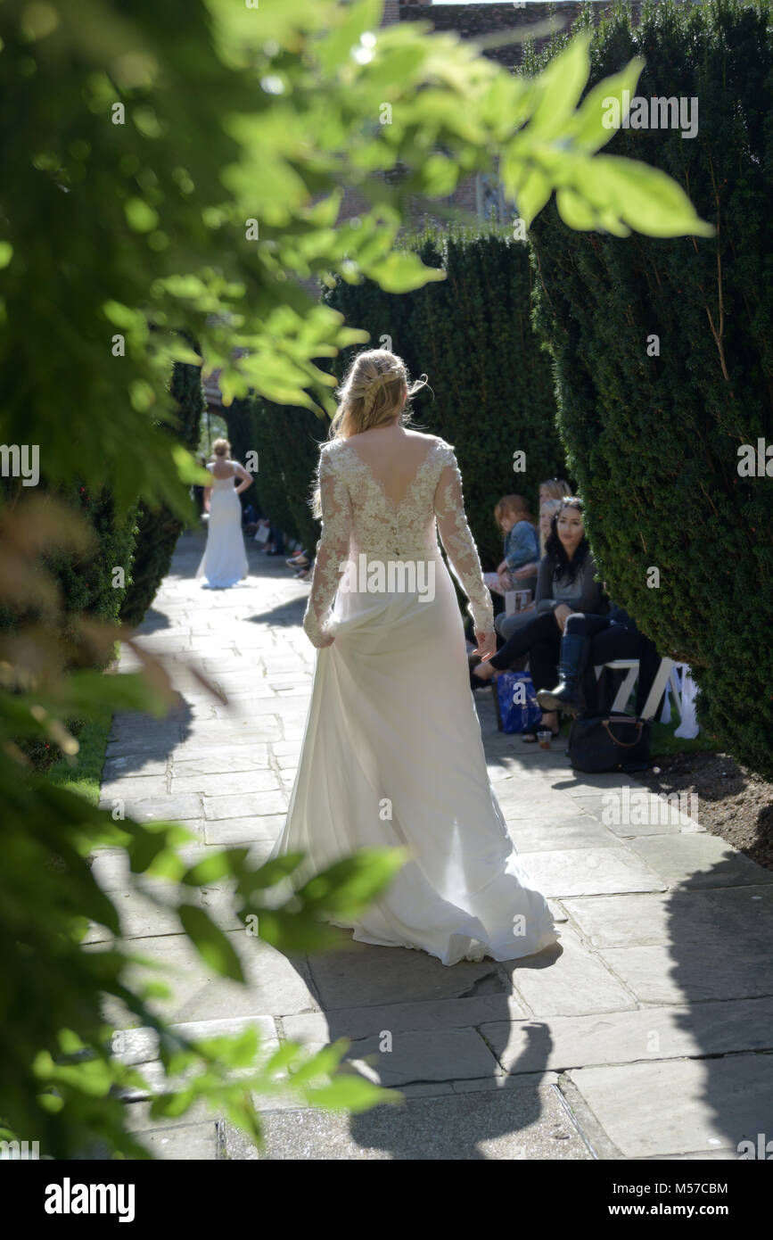 Beautiful Models wearing Bridal wear are walking on a catwalk at ...