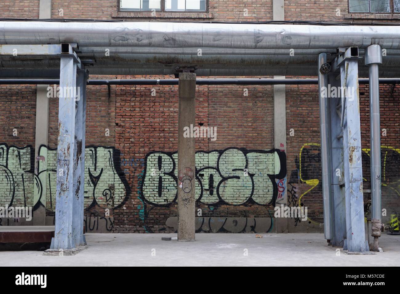 Industrial area with pipes and graffiti in Beijing China Stock Photo ...