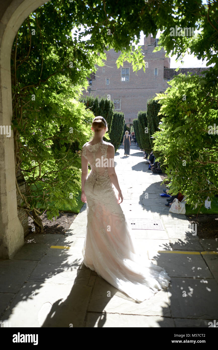 Beautiful Models wearing Bridal wear are walking on a catwalk at ...