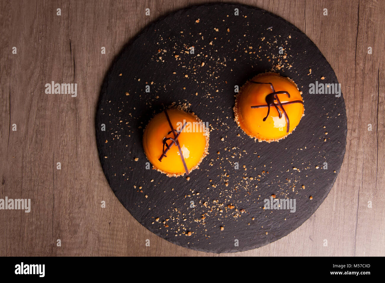 close-up of beautifully decorated delicious yellow pastry lemon dessert ...