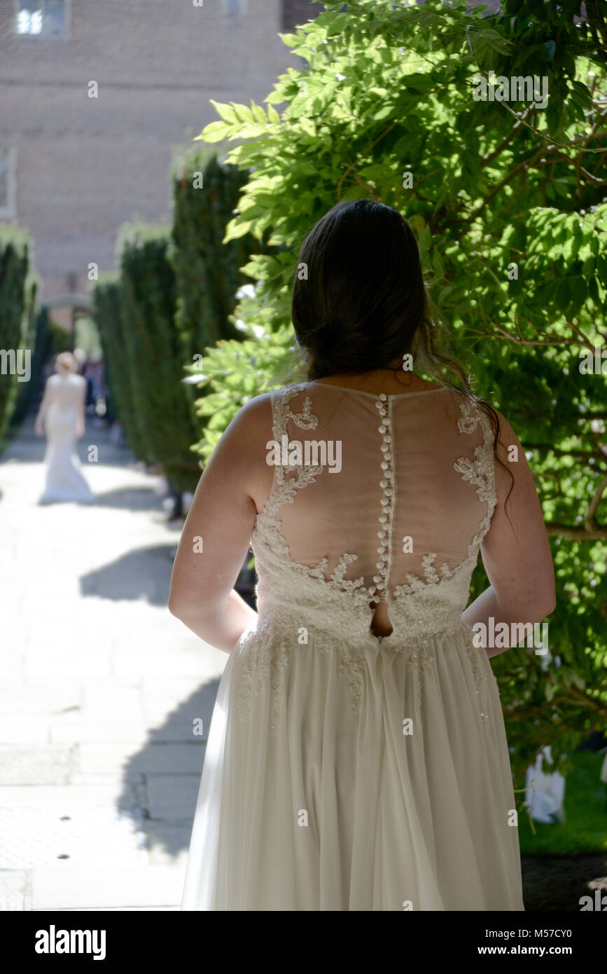Beautiful Models wearing Bridal wear are walking on a catwalk at ...