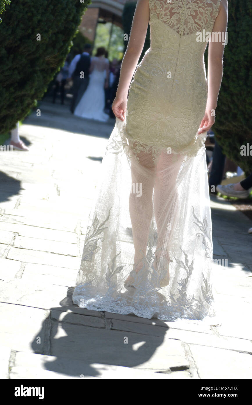 Beautiful Models wearing Bridal wear are walking on a catwalk at ...