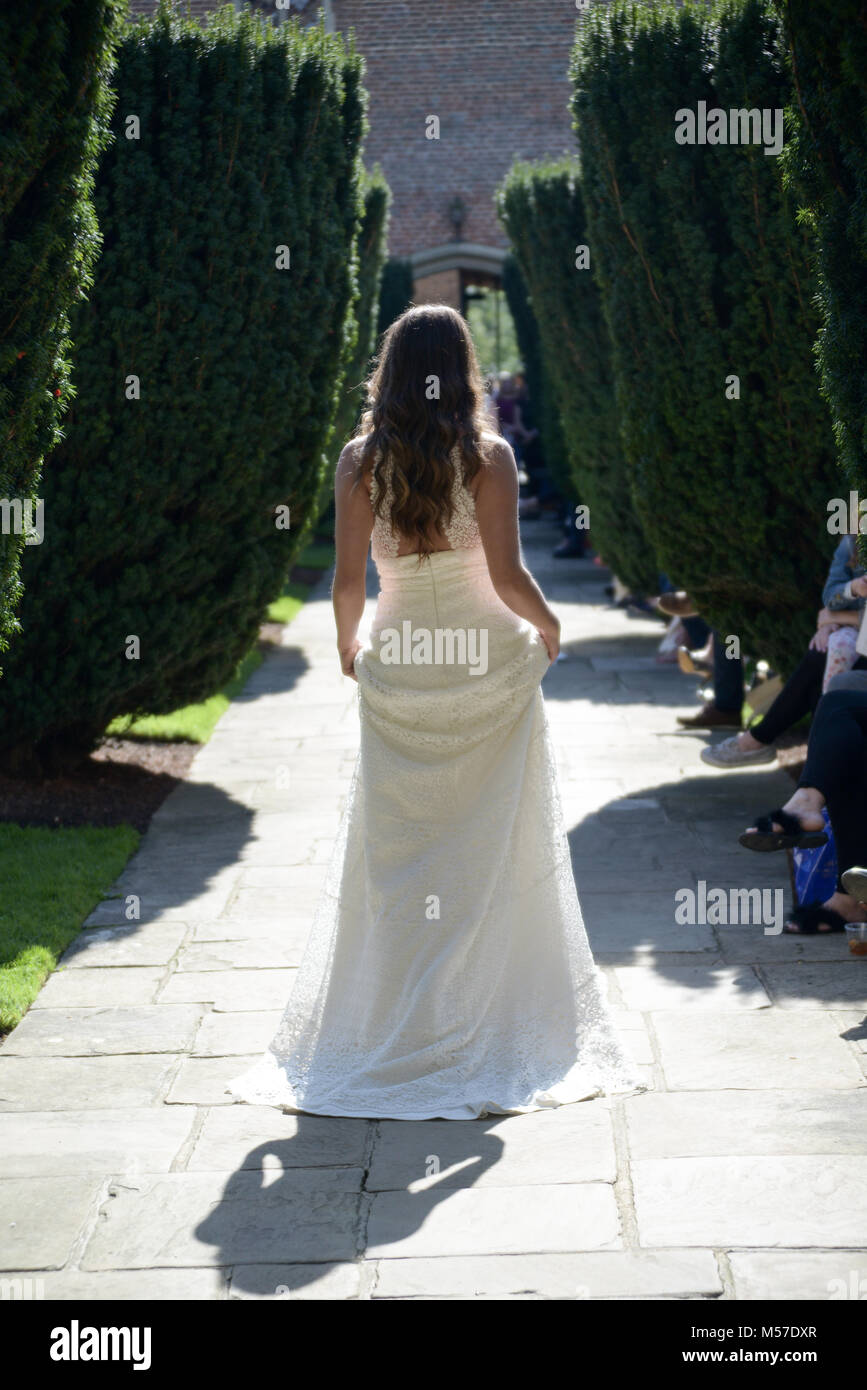 Beautiful Models wearing Bridal wear are walking on a catwalk at ...
