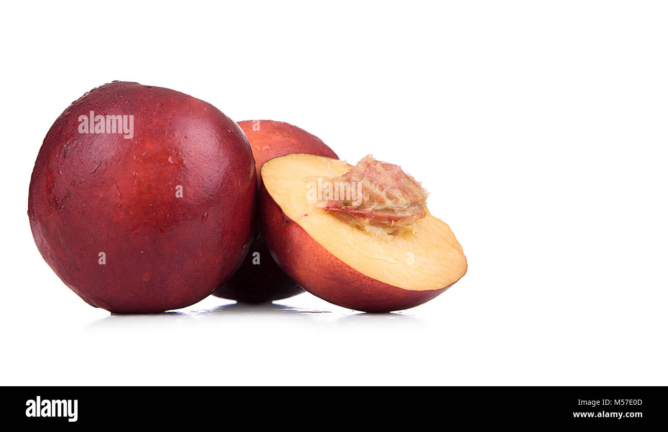Ripe juicy nectarines isolated on white background Stock Photo - Alamy
