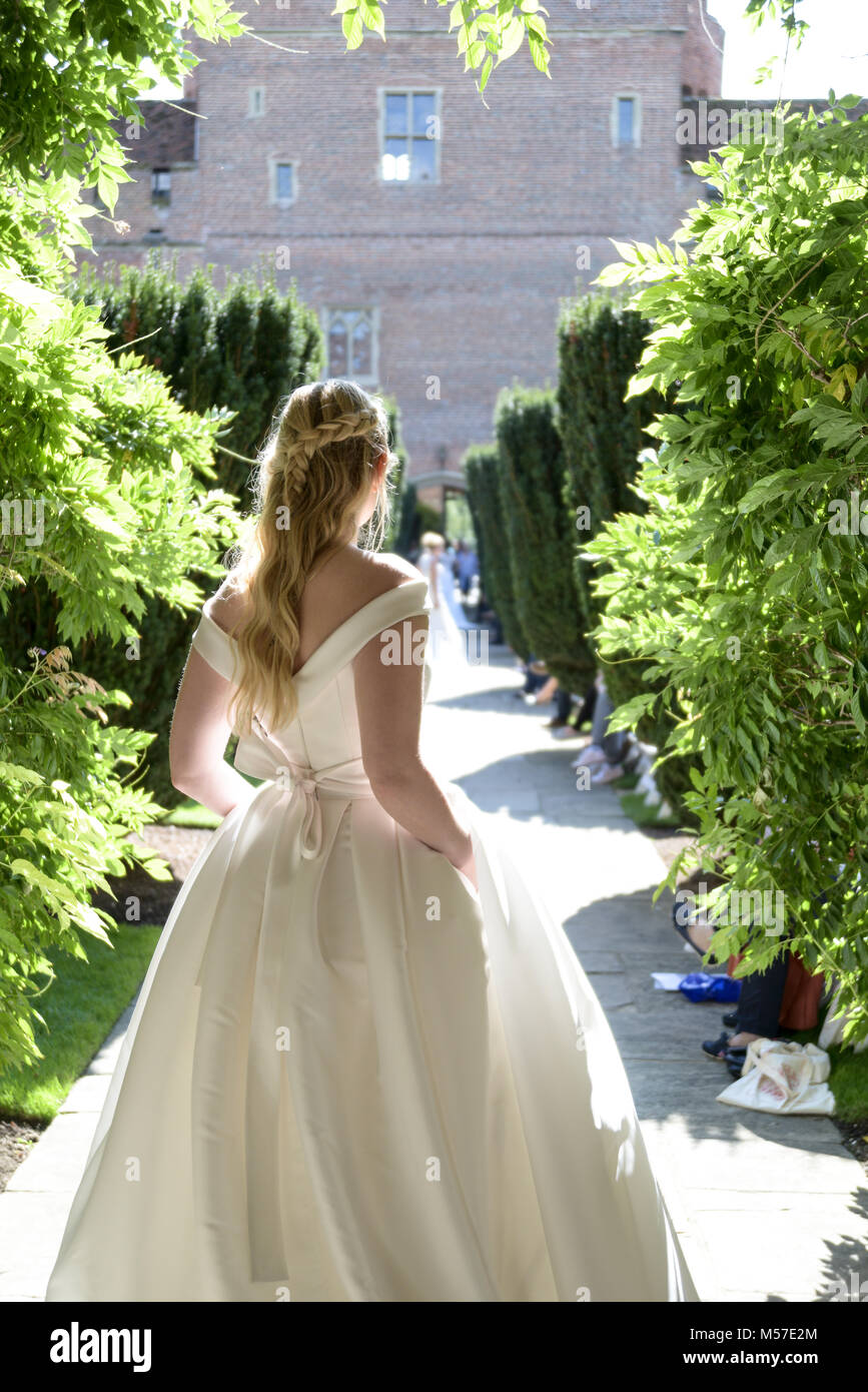 Beautiful Models wearing Bridal wear are walking on a catwalk at ...