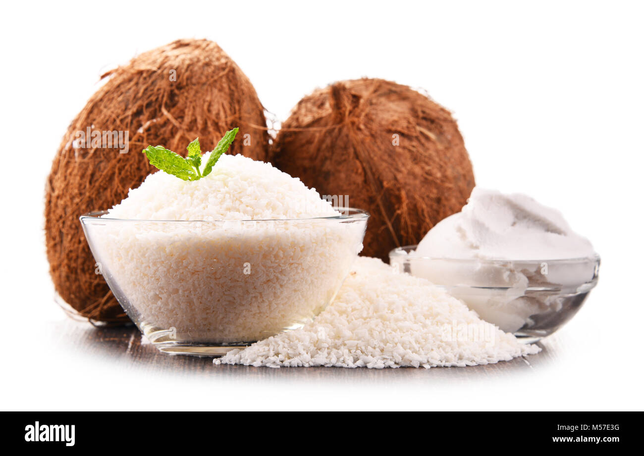 Composition with shredded coconut and shells isolated on white ...
