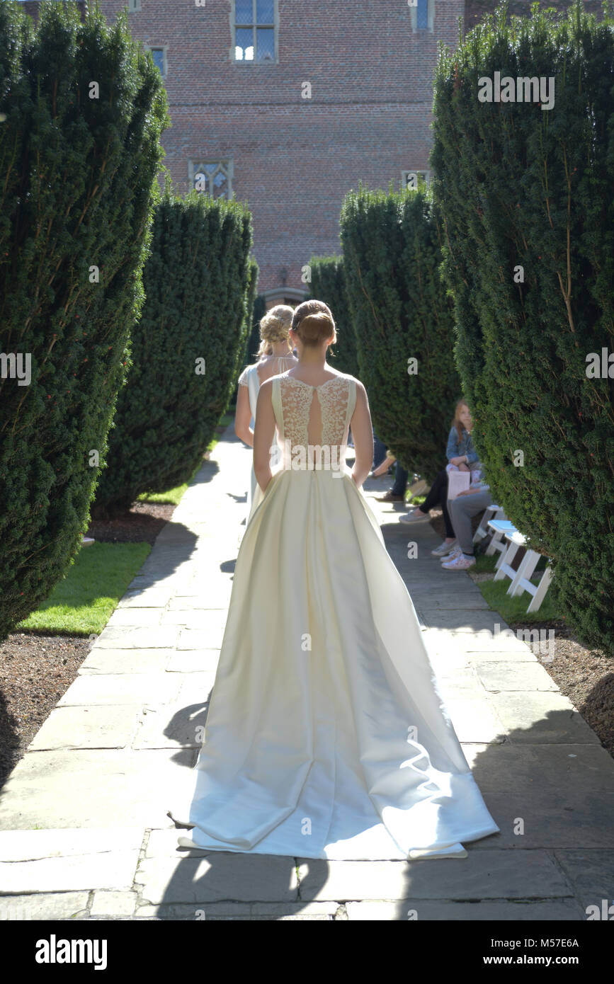 Beautiful Models wearing Bridal wear are walking on a catwalk at ...